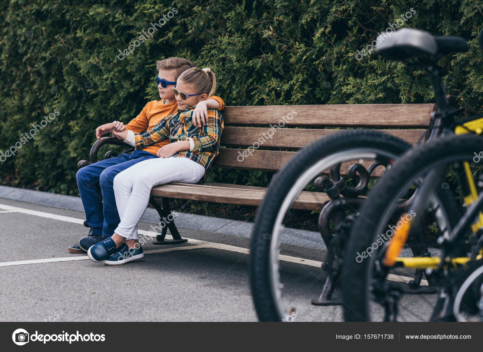 Stylish kids resting on bench at park — Free Stock Photo © alebloshka ...