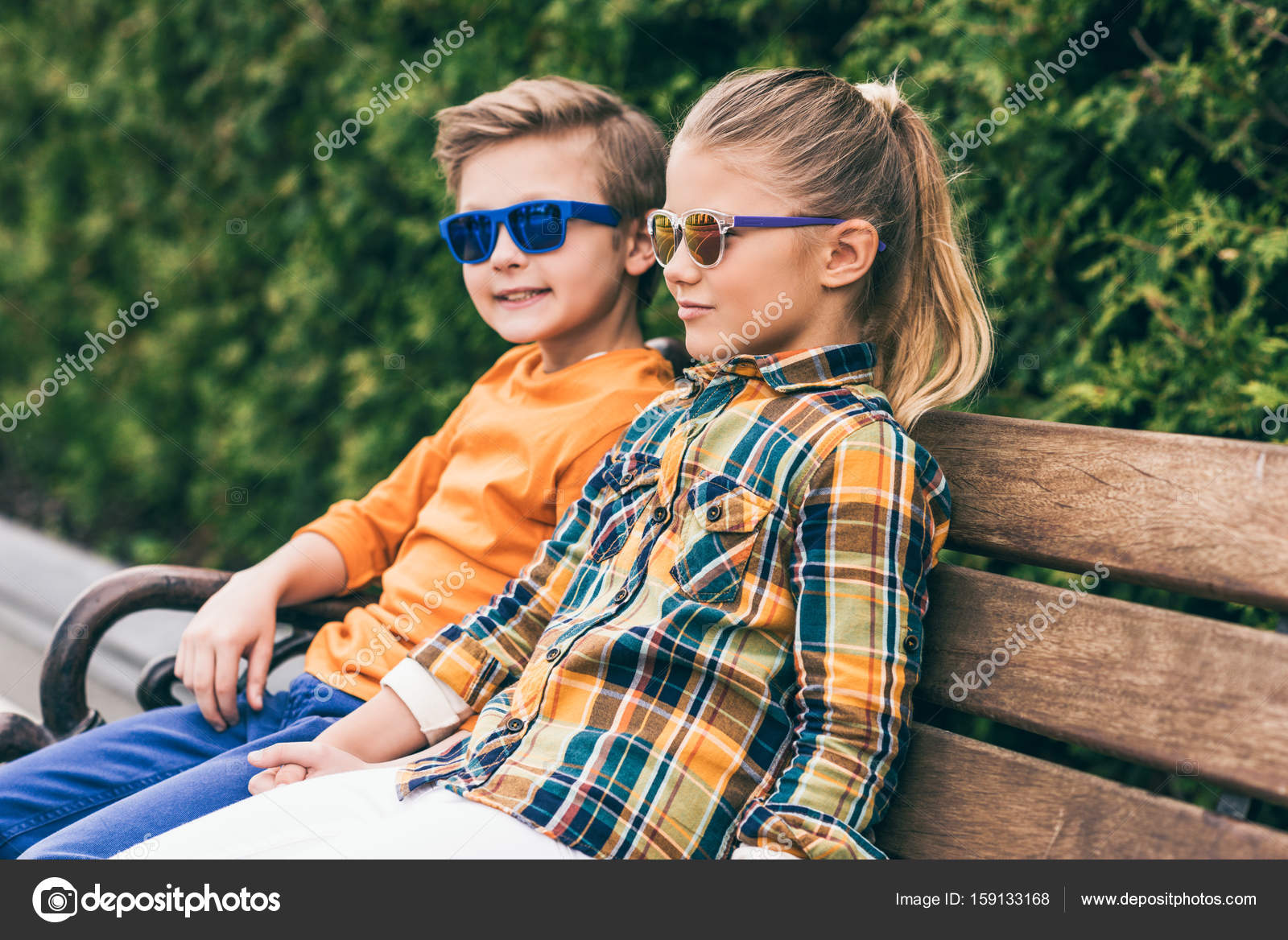Children sitting on bench Stock Photo by ©alebloshka 159133168