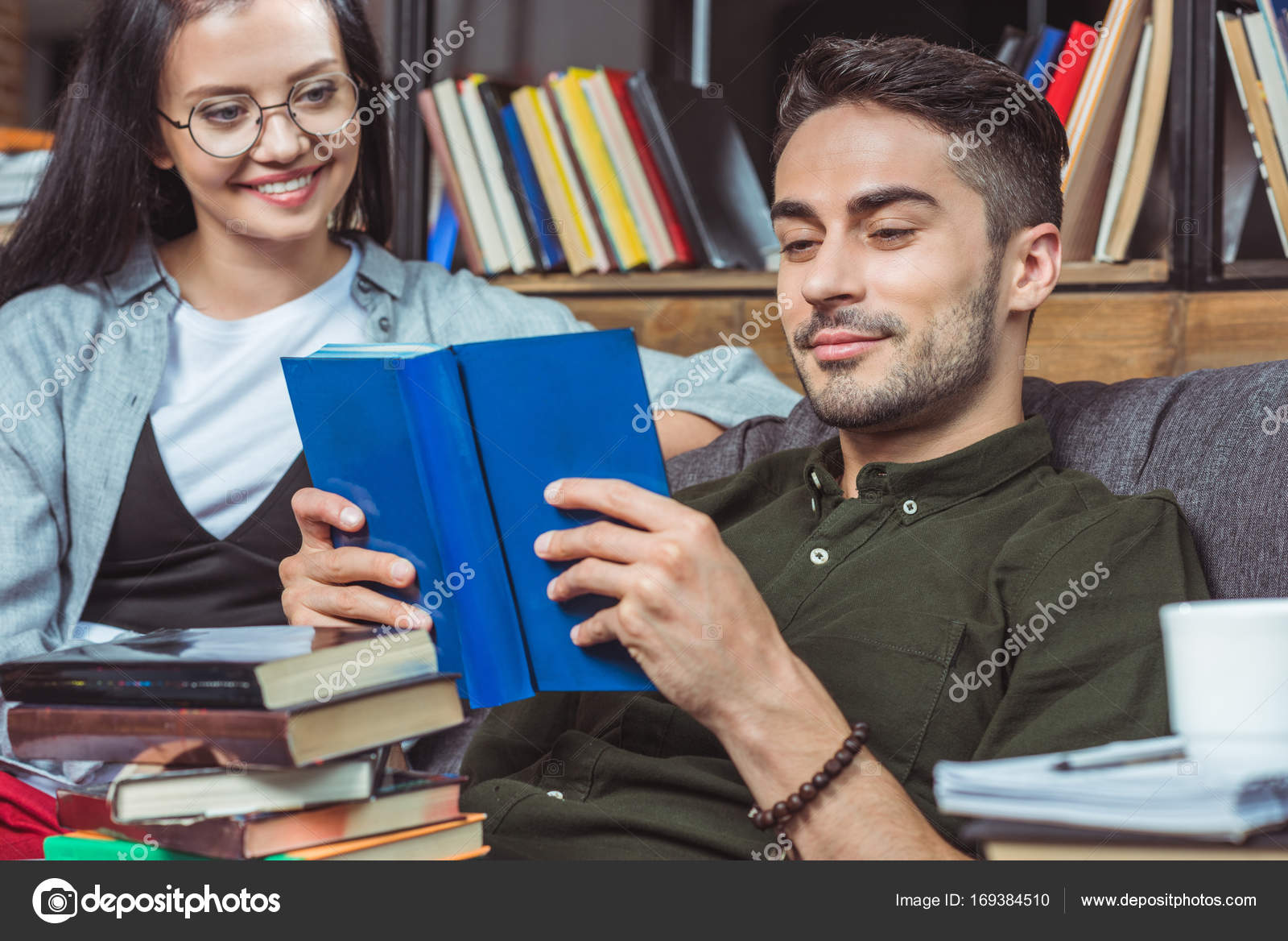 Couple reading books Stock Photo by ©alebloshka 169384510