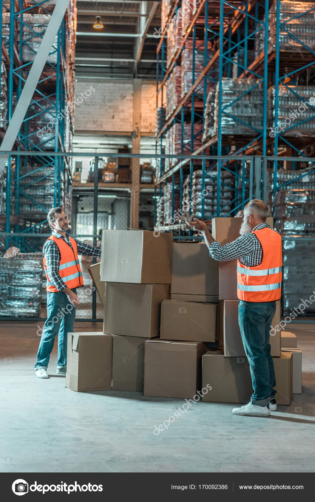 Warehouse workers with boxes Stock Photo by ©alebloshka 170092386