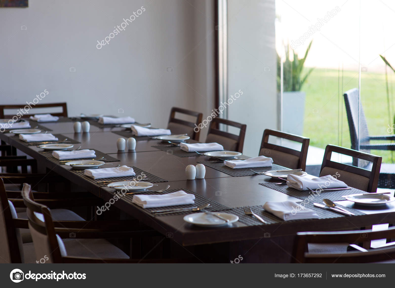 Served table in empty restaurant Stock Photo by ©alebloshka 173657292