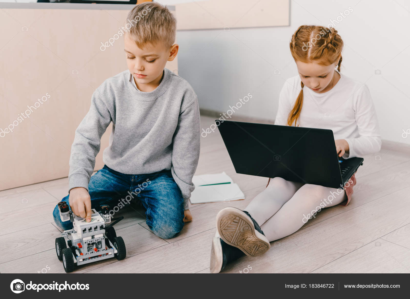Focused Kids Sitting Floor Stem Education Class Robot Laptop Stock ...