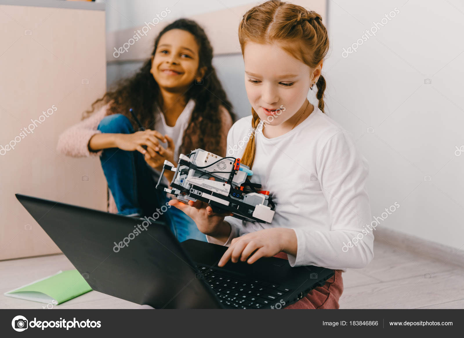 Teen Schoolgirls Programming Robot While Sitting Floor Stock Photo by ...
