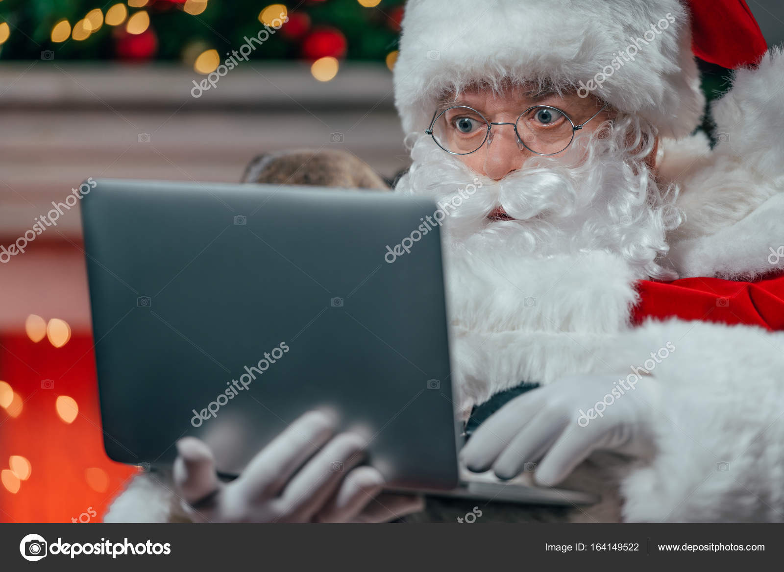 Santa claus using laptop — Stock Photo © GeneGlavitsky #164149522
