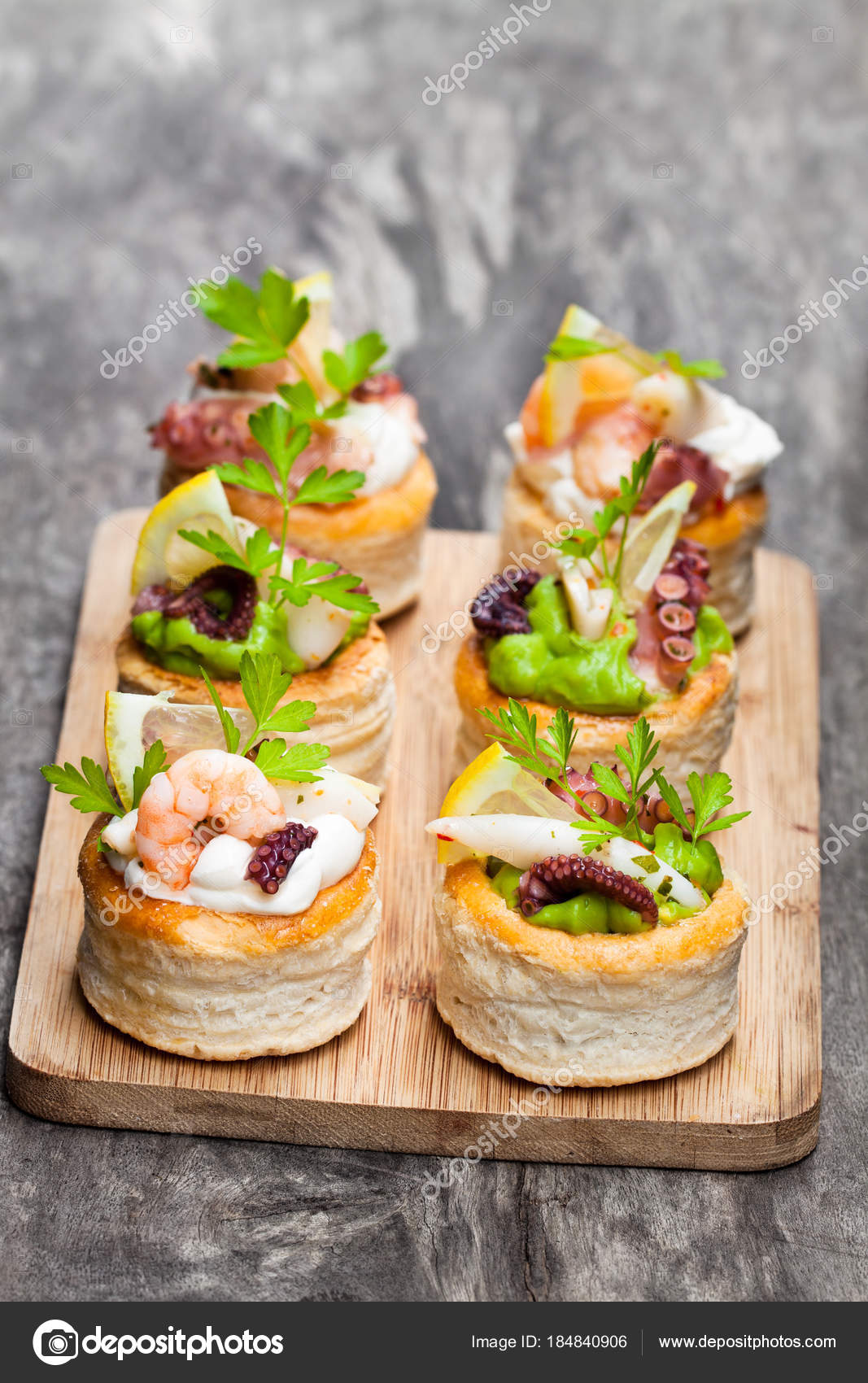 Vol-au-vents puff pastry cases filled with salted squid and oct Stock ...