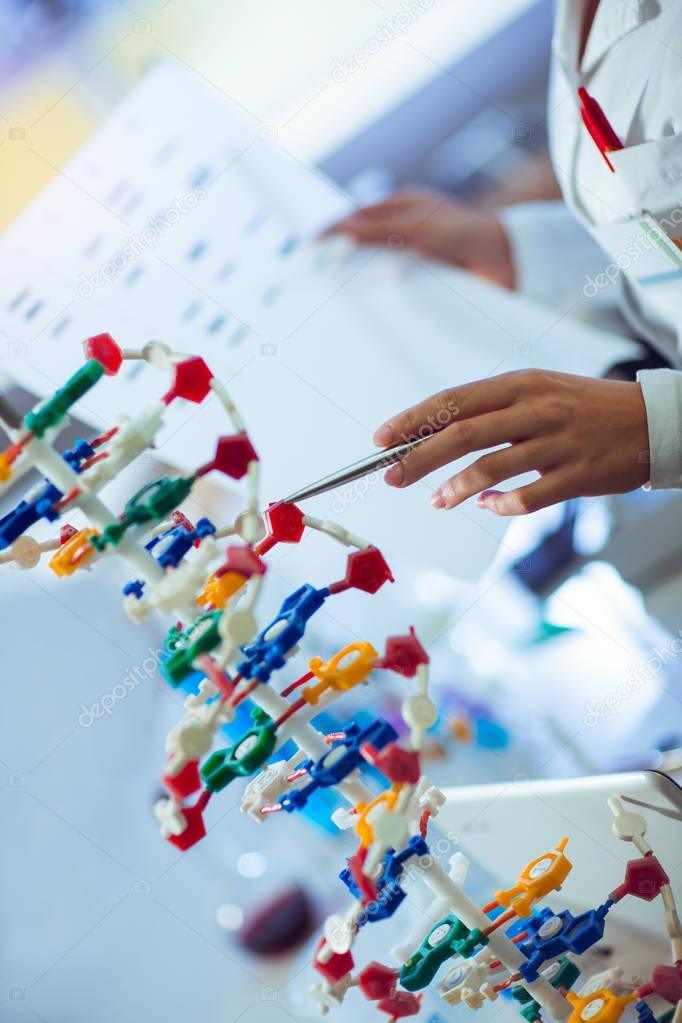 Scientist looking at DNA in laboratory — Stock Photo © adriaticphoto ...