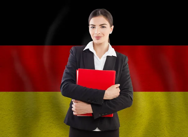 Woman against German flag. Distance learning in Germany - Stock Image ...