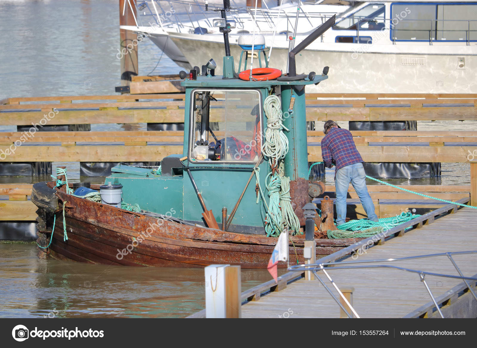 Tug Boat Operator and Boat Stock Photo by ©modfos 153557264