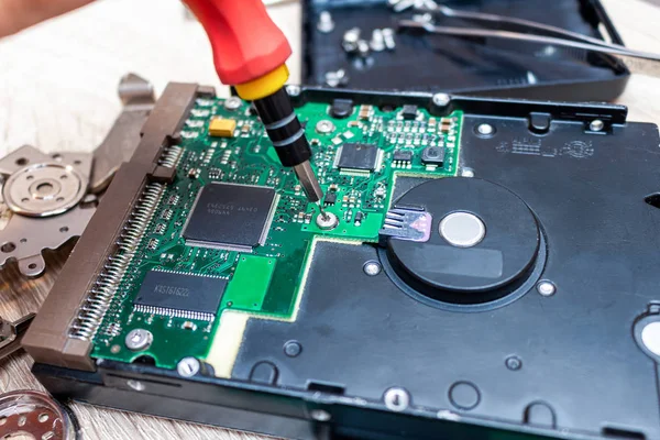 old broken hard disk drives composition in a repair recovery service concept close up selective ...