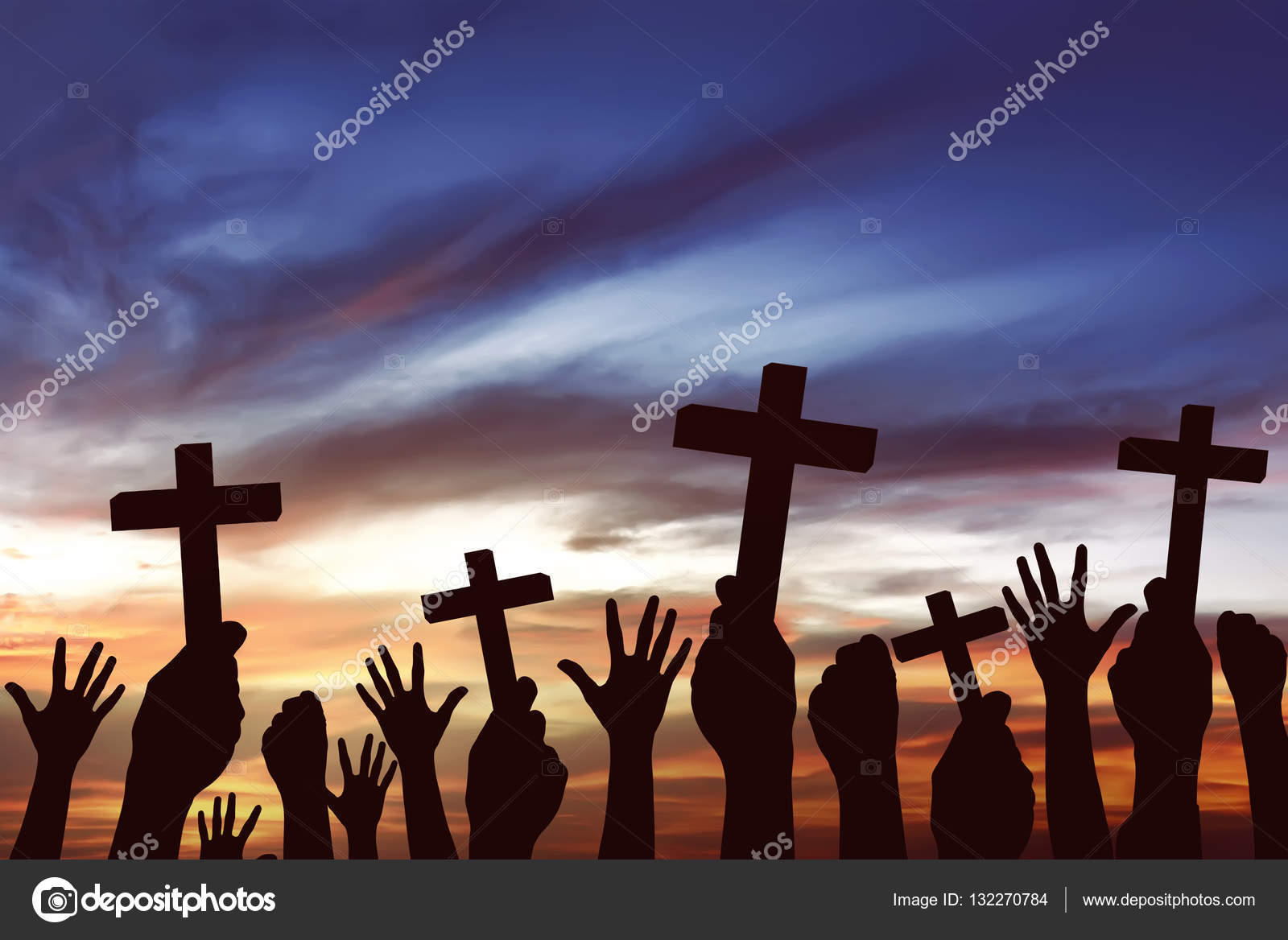 Many hands holding christian cross Stock Photo by ©leolintang 132270784