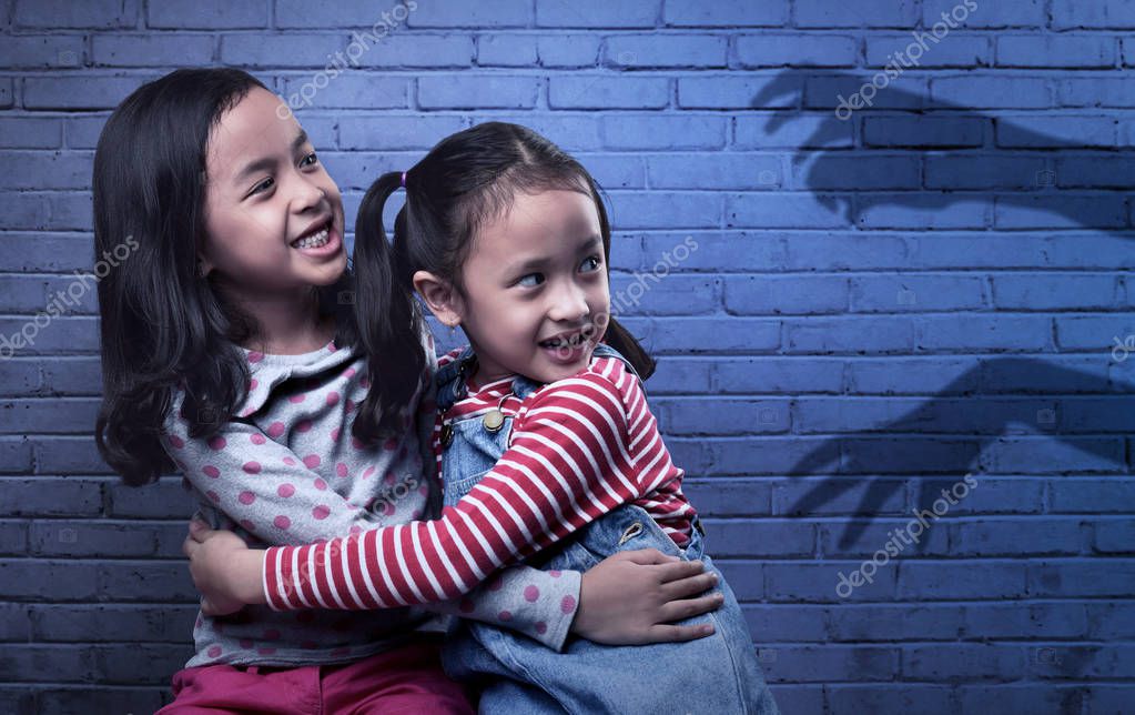 Scared two asian little girls — Stock Photo © leolintang #150950462