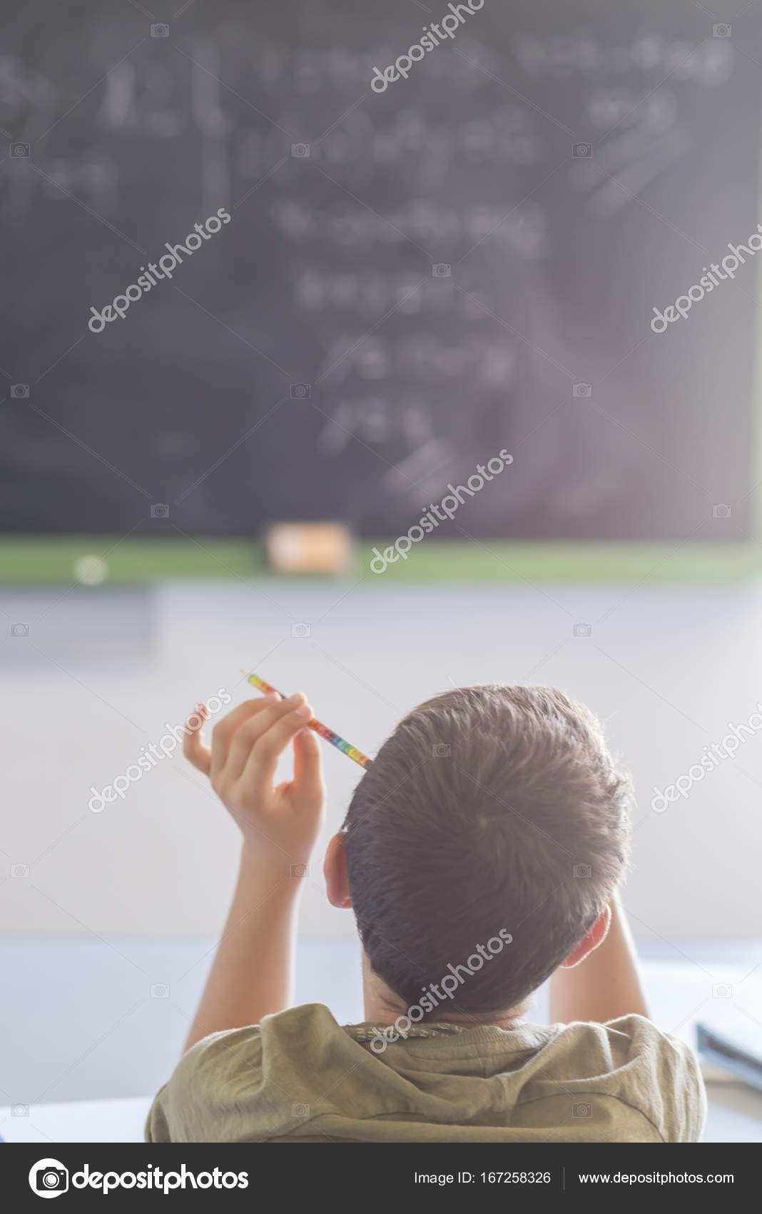 Student attending in a classroom during a lesson Stock Photo by ...