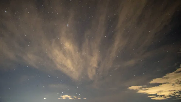 Clouds In the sky at night viewing the stars as Orion rises. - Stock ...