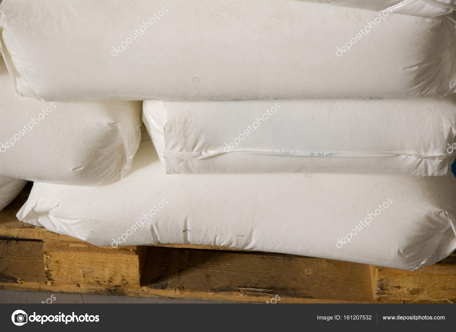 White full bags on a pallet in dry warehouses. — Stock Photo © kanzefar ...