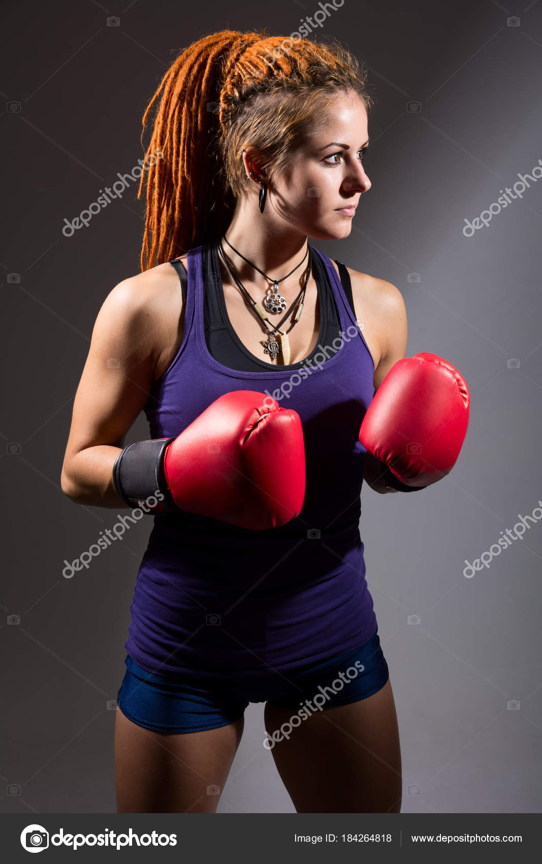 Young woman boxer with dreadlocks — Stock Photo © kanzefar #184264818