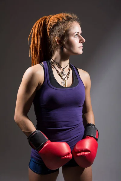 Young woman boxer with dreadlocks — Stock Photo © kanzefar #184264818