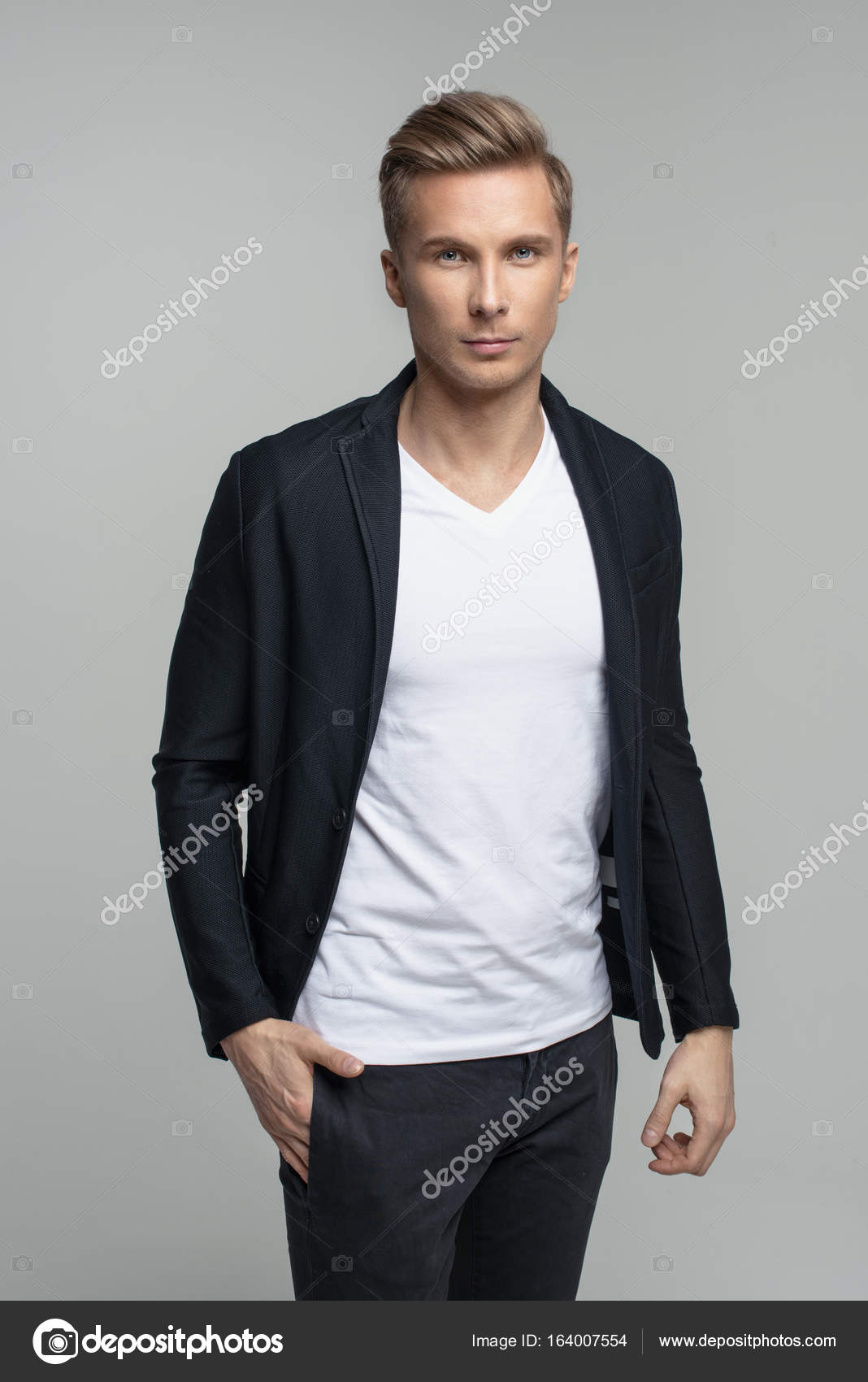 Elegant young male model in studio Stock Photo by ©aarrttuurr 164007554