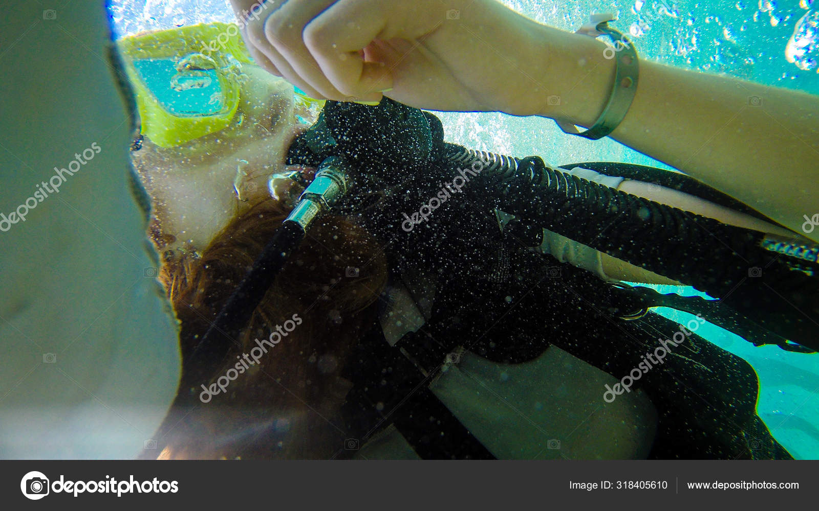 Diving with air balloon in the red sea. Instructor. Girl and cor ...