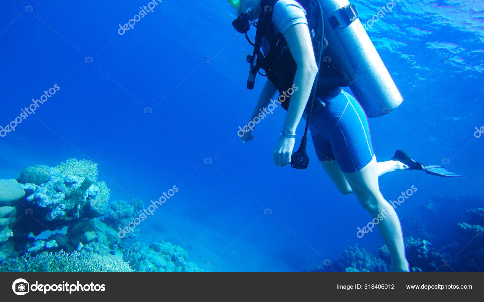 Diving with air balloon in the red sea. Instructor. Girl and cor ...
