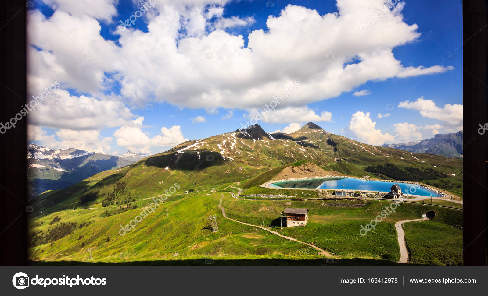 A Swiss Alpine Scenery view from train window pane, en route to ...