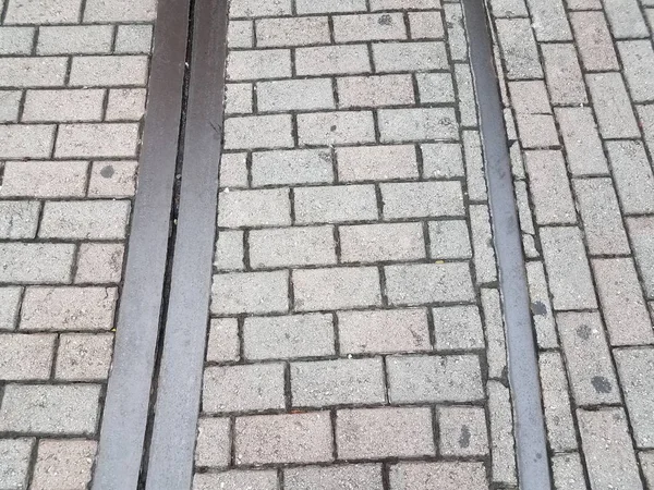 red bricks or ground with metal train track - Stock Image - Everypixel