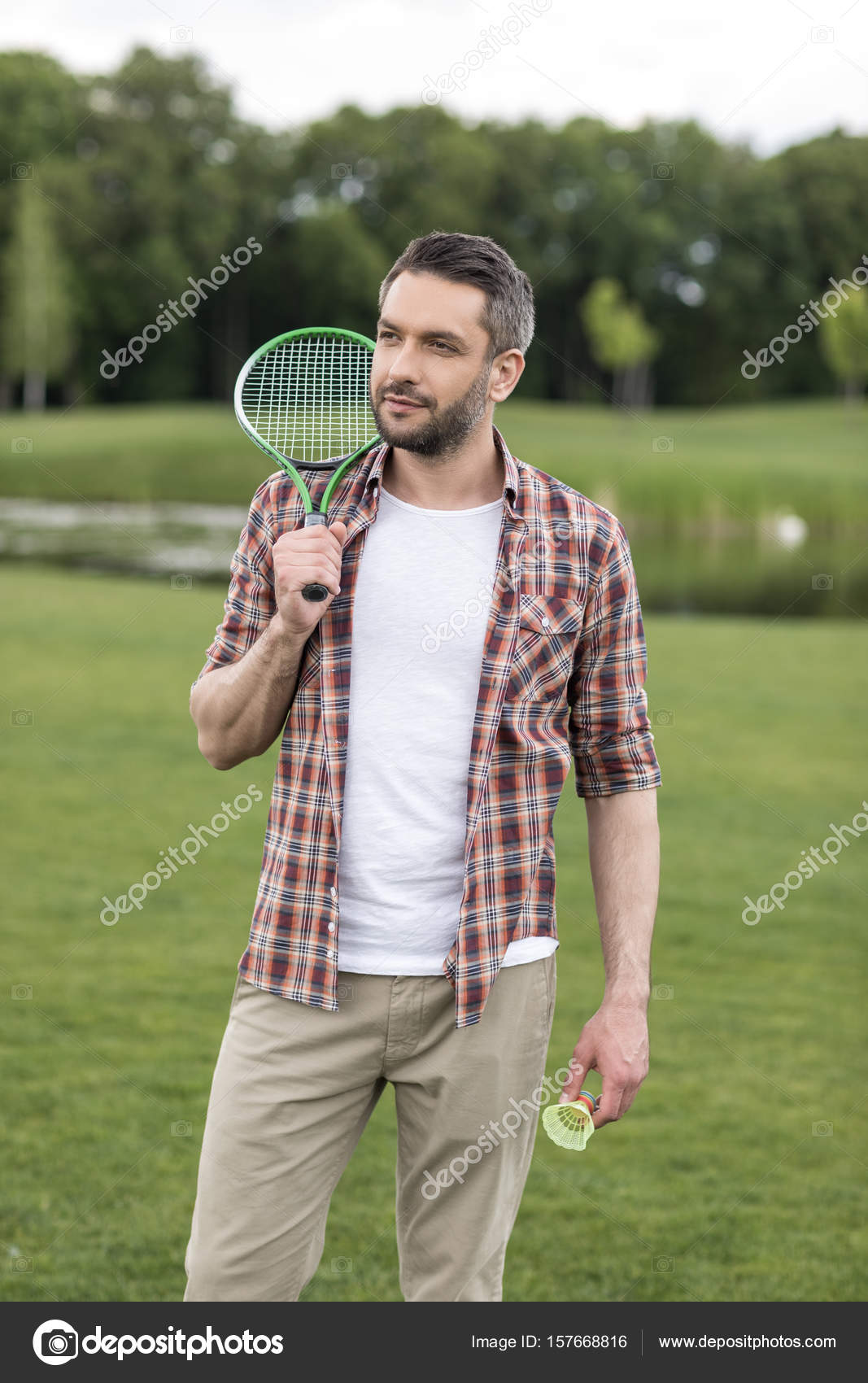 Man playing badminton — Stock Photo © IgorVetushko #157668816