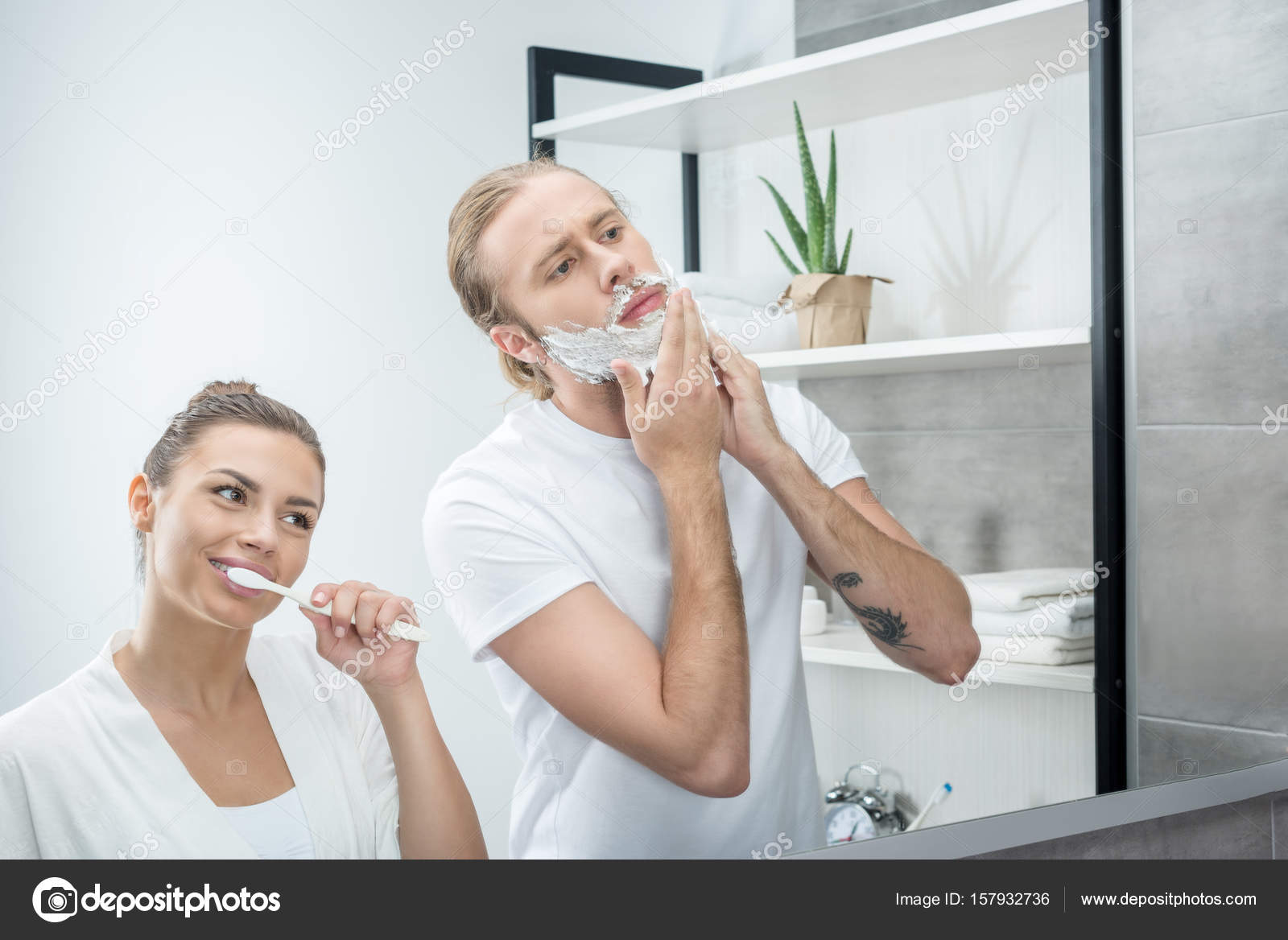 Couple doing morning routine — Stock Photo © IgorVetushko #157932736