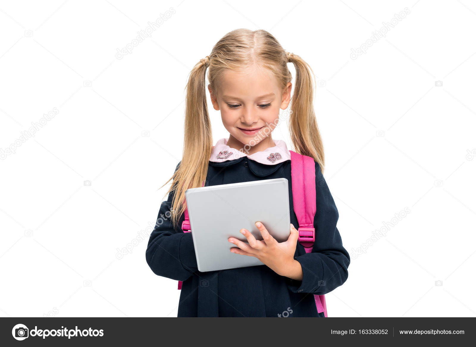 Schoolgirl using digital tablet — Stock Photo © IgorVetushko #163338052
