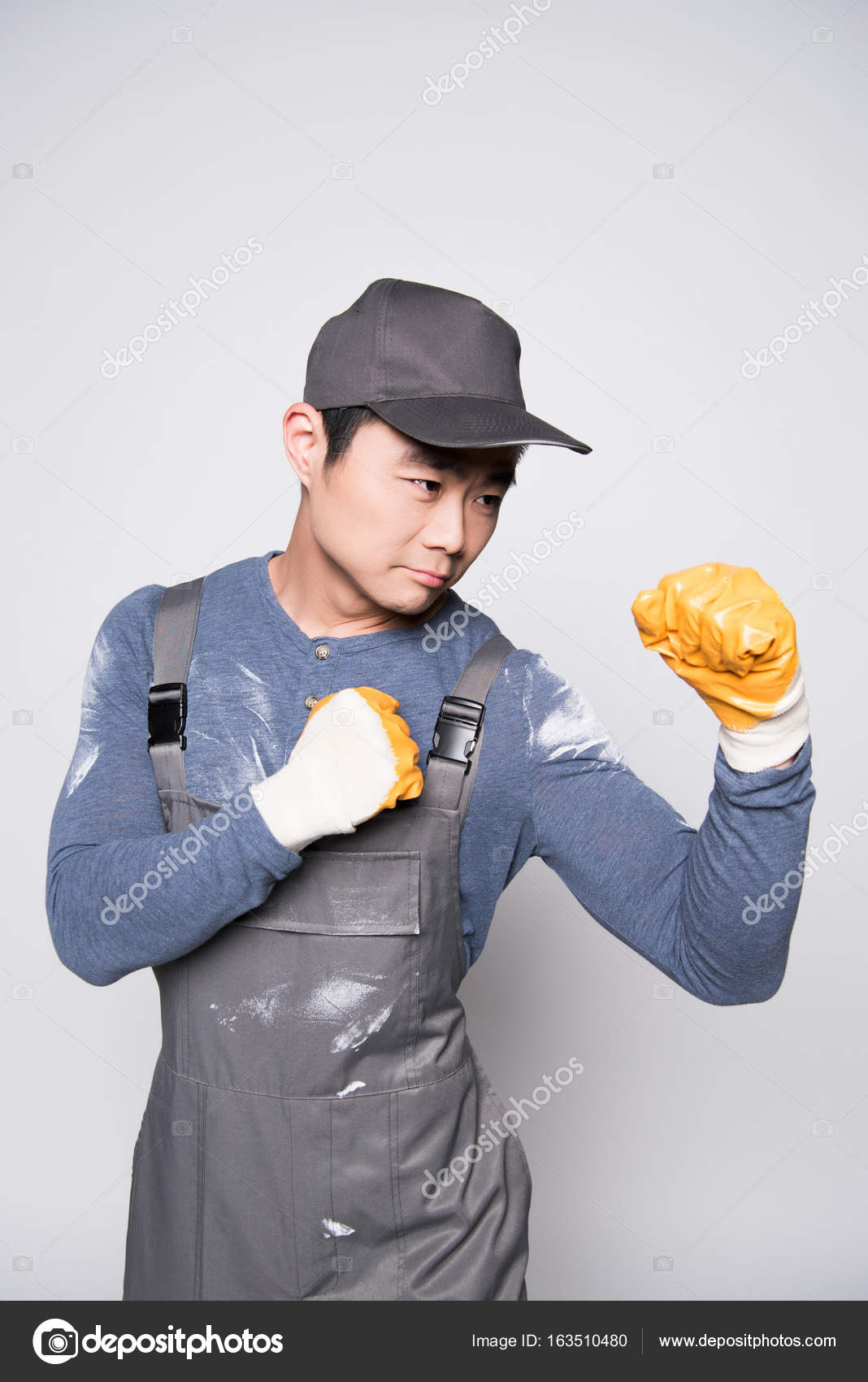 Construction worker in fighting pose Stock Photo by ©IgorVetushko 163510480