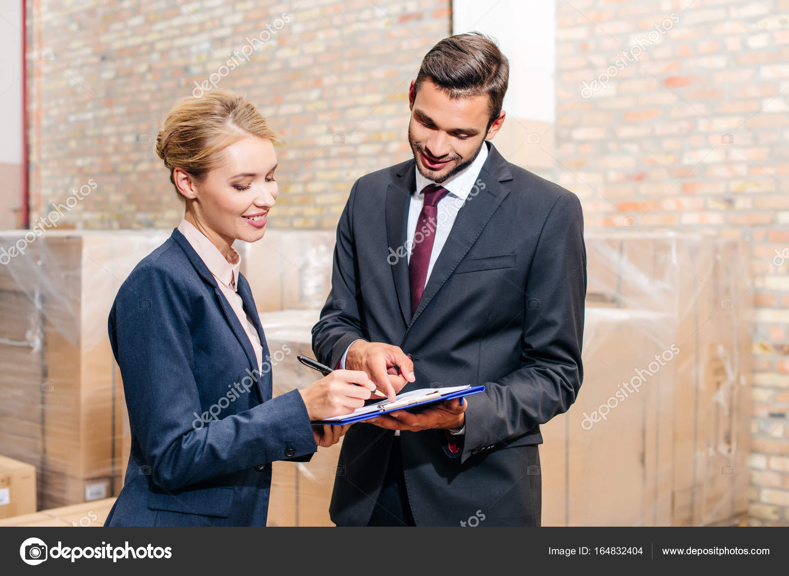 Business colleagues at warehouse — Stock Photo © IgorVetushko #164832404 Business colleagues at warehouse — Stock Photo © IgorVetushko #164832404