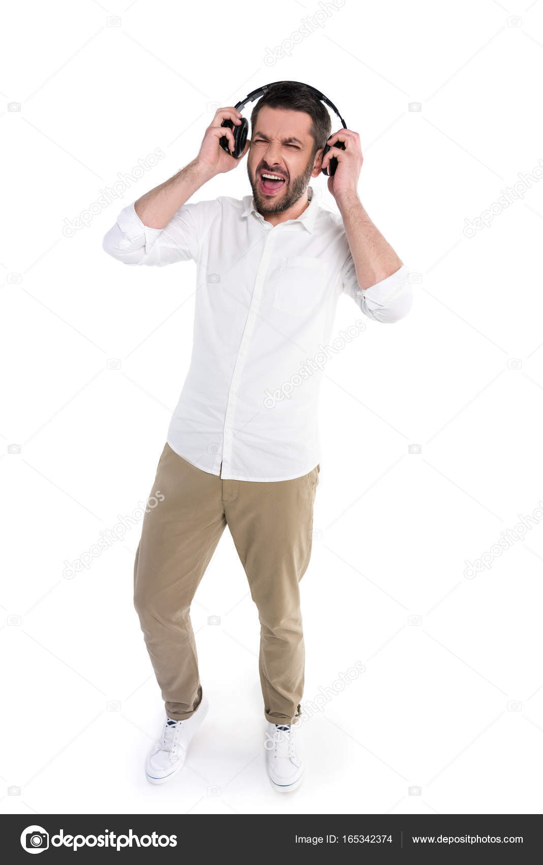Man taking off headphones Stock Photo by ©IgorVetushko 165342374
