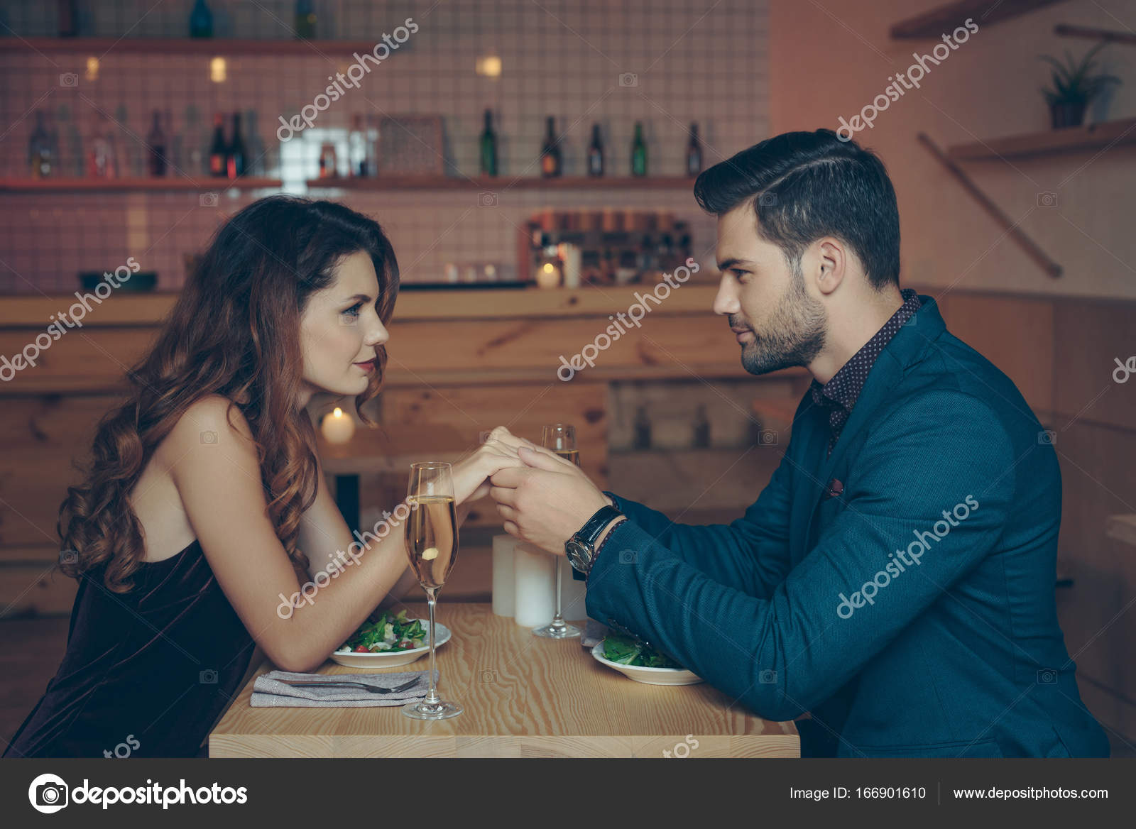 Couple having romantic dinner — Stock Photo © IgorVetushko #166901610 Couple having romantic dinner — Stock Photo © IgorVetushko #166901610