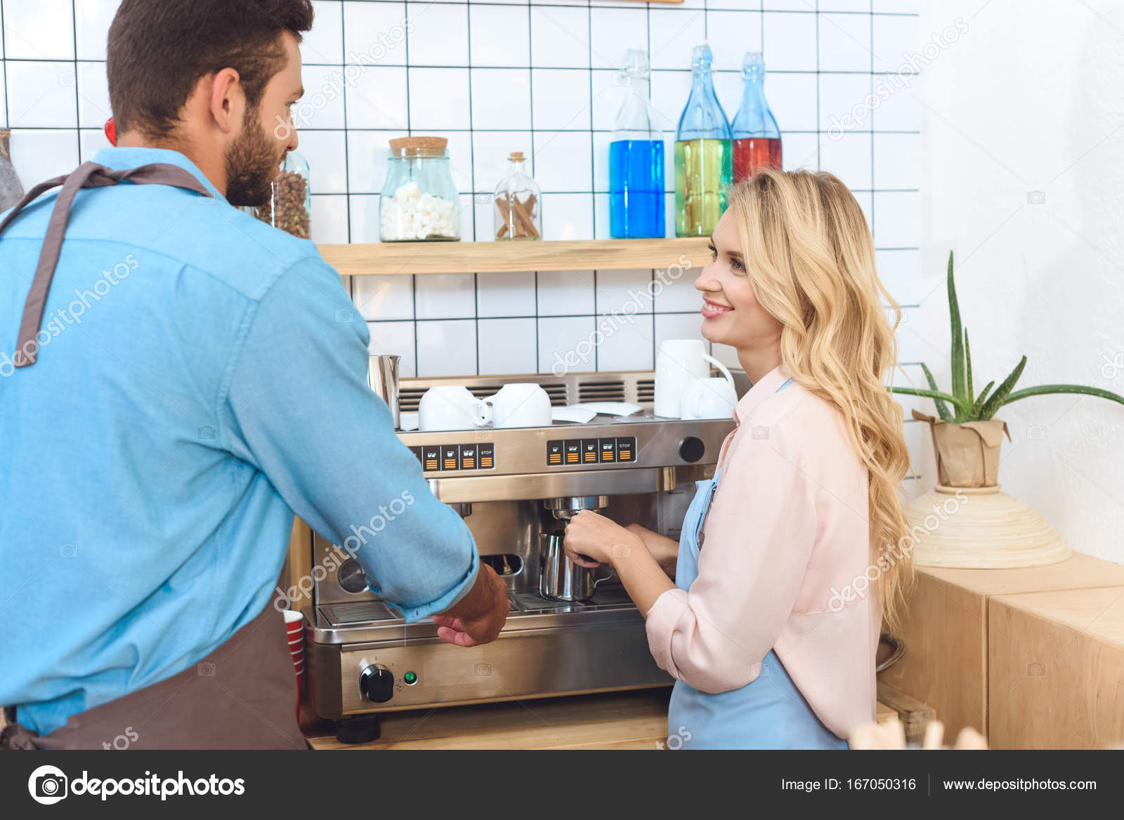 Cafe workers making coffee — Stock Photo © IgorVetushko #167050316