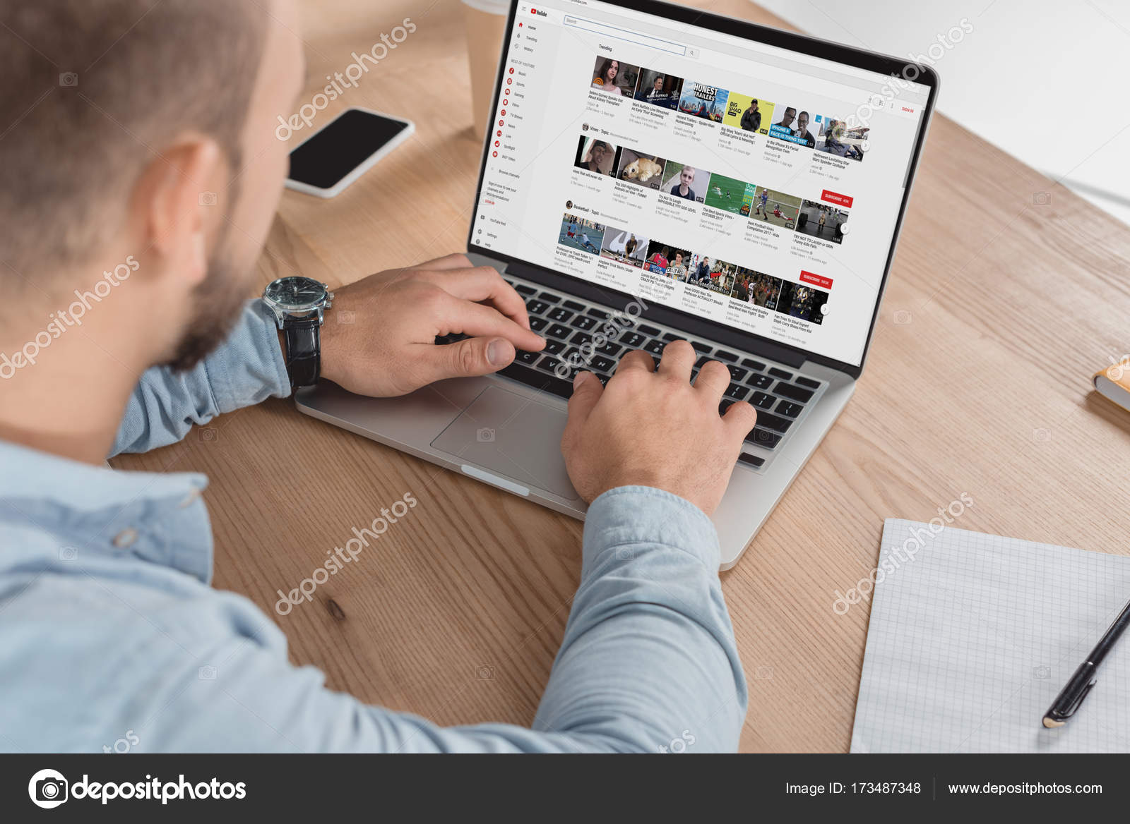 Using laptop — Stock Editorial Photo © IgorVetushko #173487348