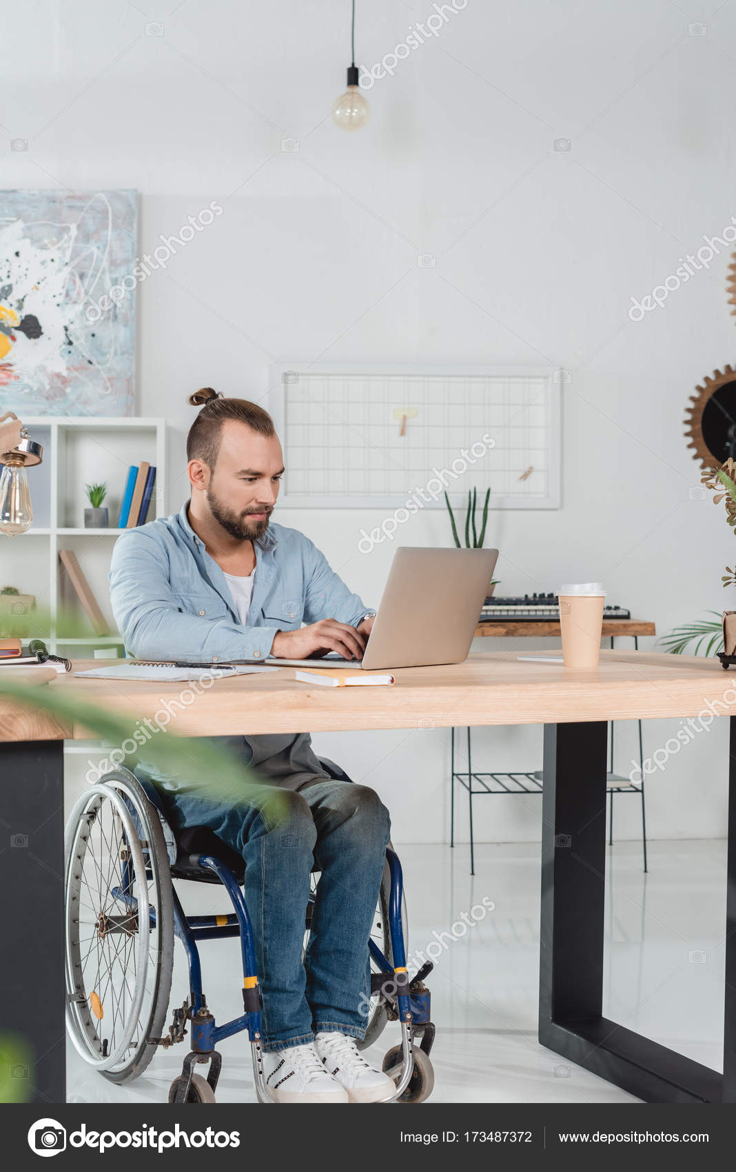 Man on wheelchair working with laptop — Stock Photo © IgorVetushko ...