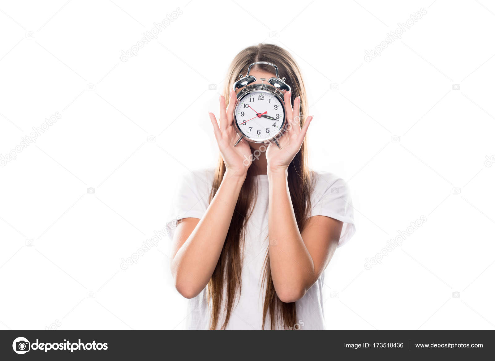 Girl covering face with alarm clock — Stock Photo © IgorVetushko #173518436