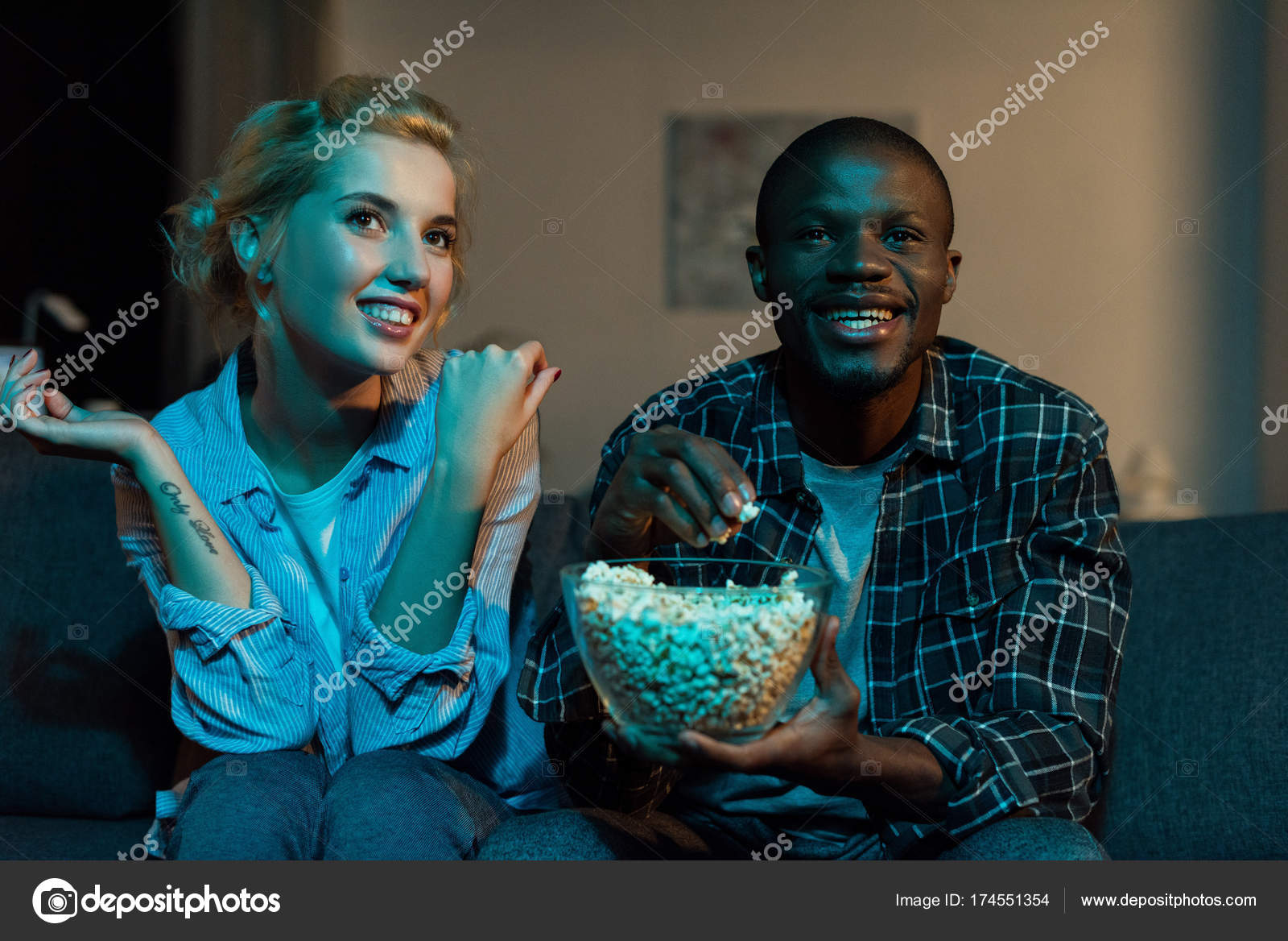 Portrait Cheerful Multiethnic Couple Watching Together Sofa Home ...