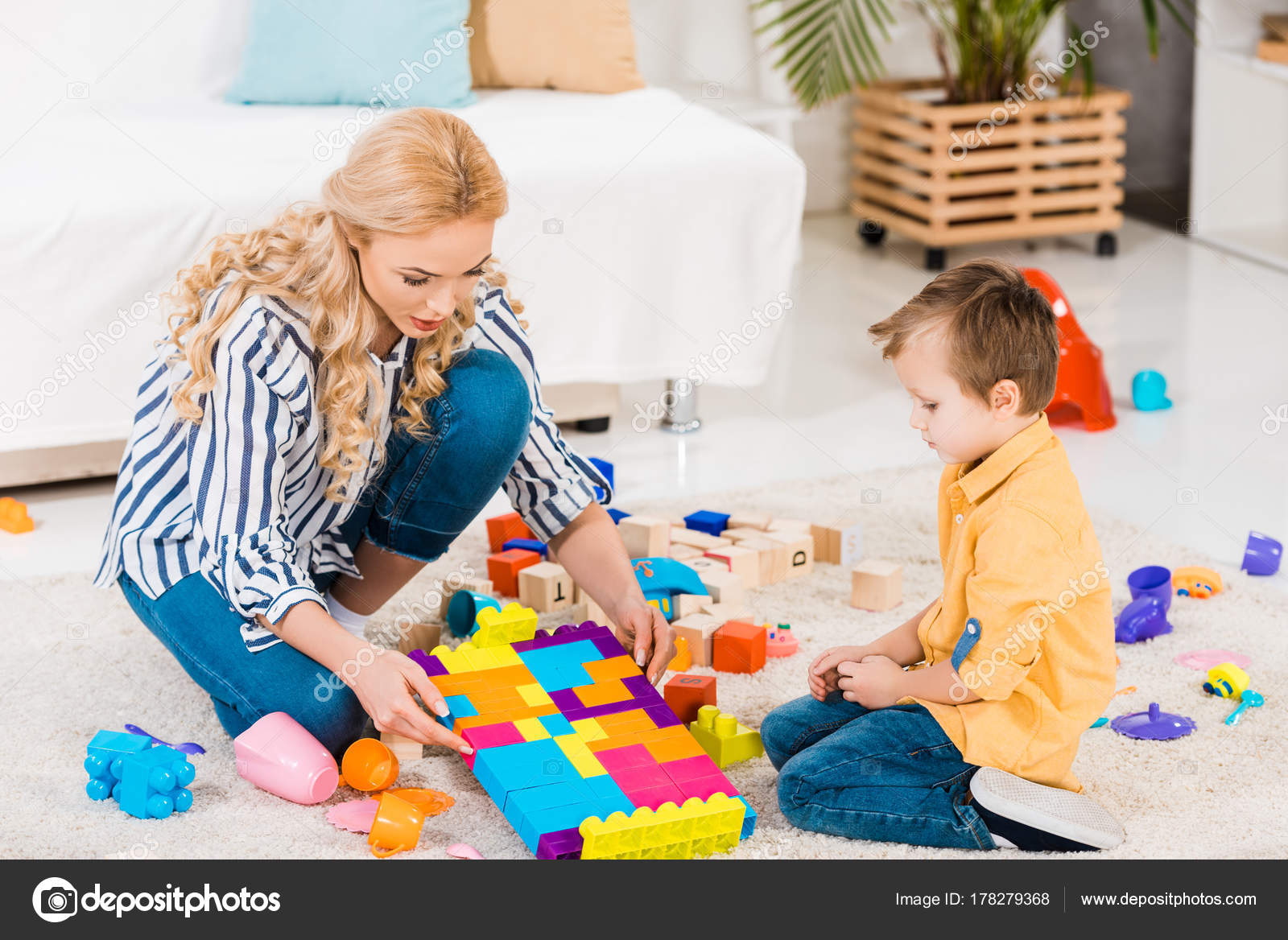 Focused Mother Little Son Playing Toys Together Floor Home — Stock ...