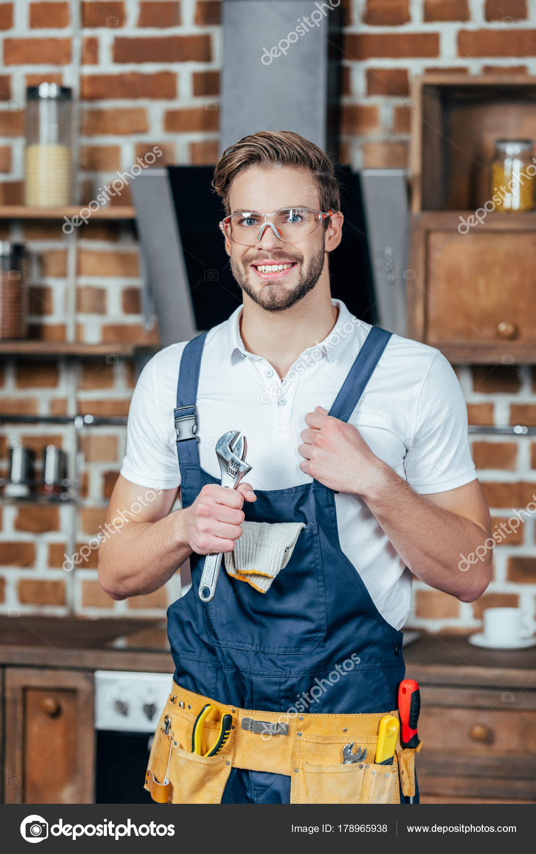 Handsome Young Repairman Holding Adjustive Wrench Smiling Camera Stock ...