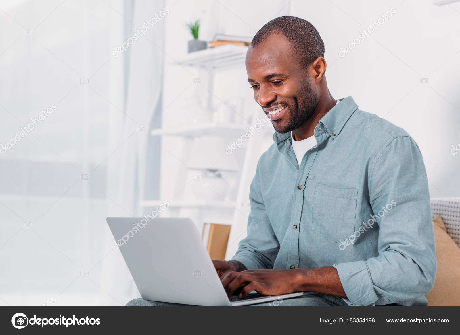 Happy African American Man Using Laptop Sofa Home Stock Photo by ...