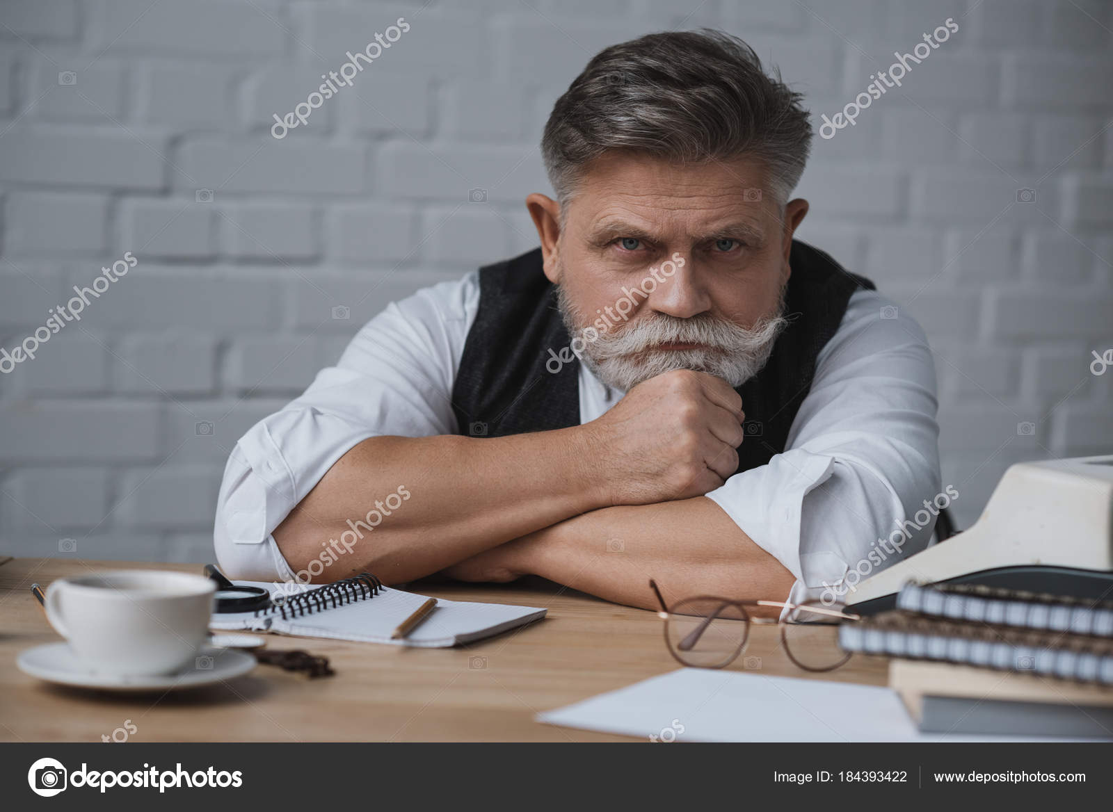 Bearded Senior Writer Sitting Workplace Looking Camera Stock Photo by ...
