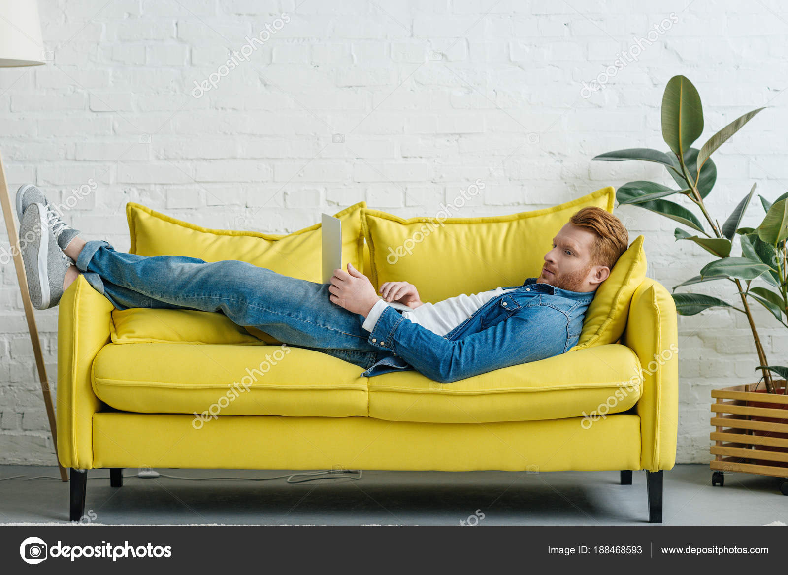 Young Man Lying Sofa Open Laptop — Stock Photo © IgorVetushko #188468593 Young Man Lying Sofa Open Laptop — Stock Photo © IgorVetushko #188468593