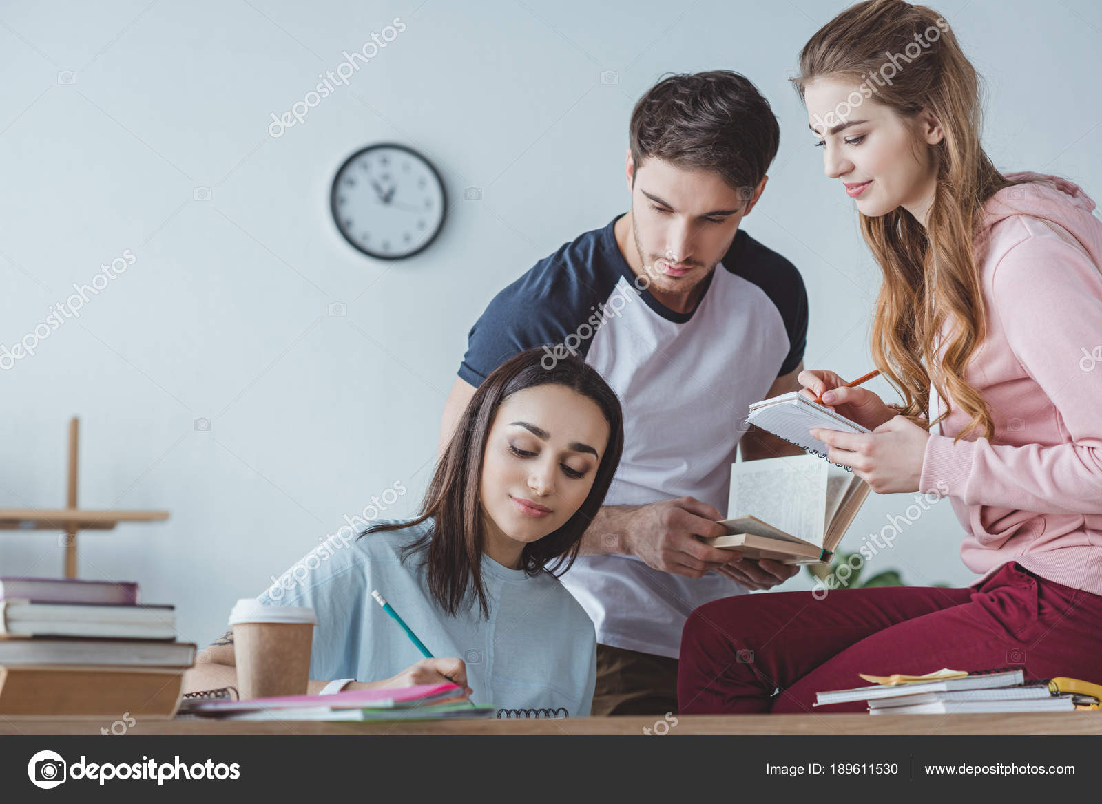 Young Students Sitting Table Studying Together Stock Photo by ...