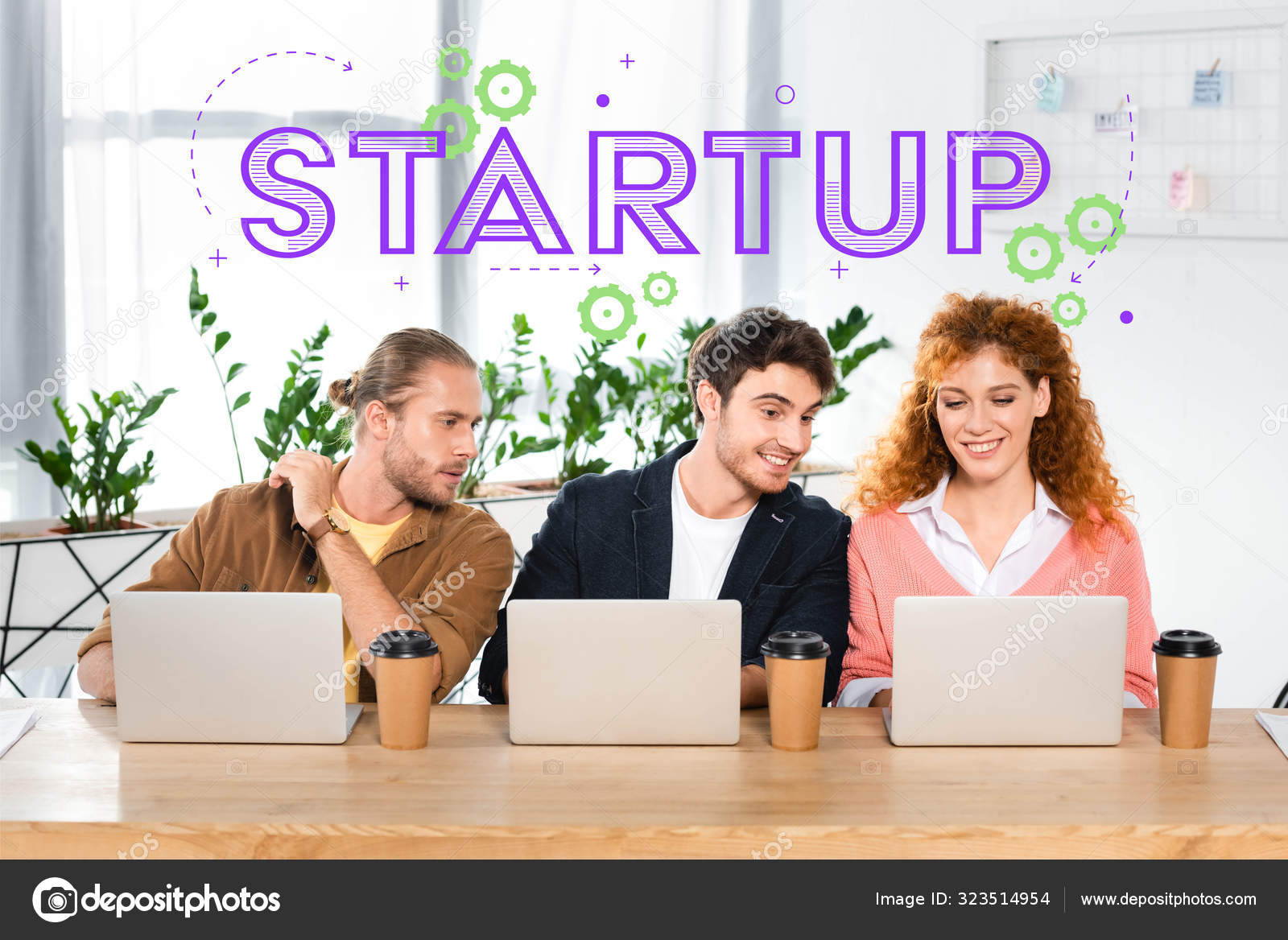 Three Smiling Friends Sitting Table Using Laptops Office Startup ...