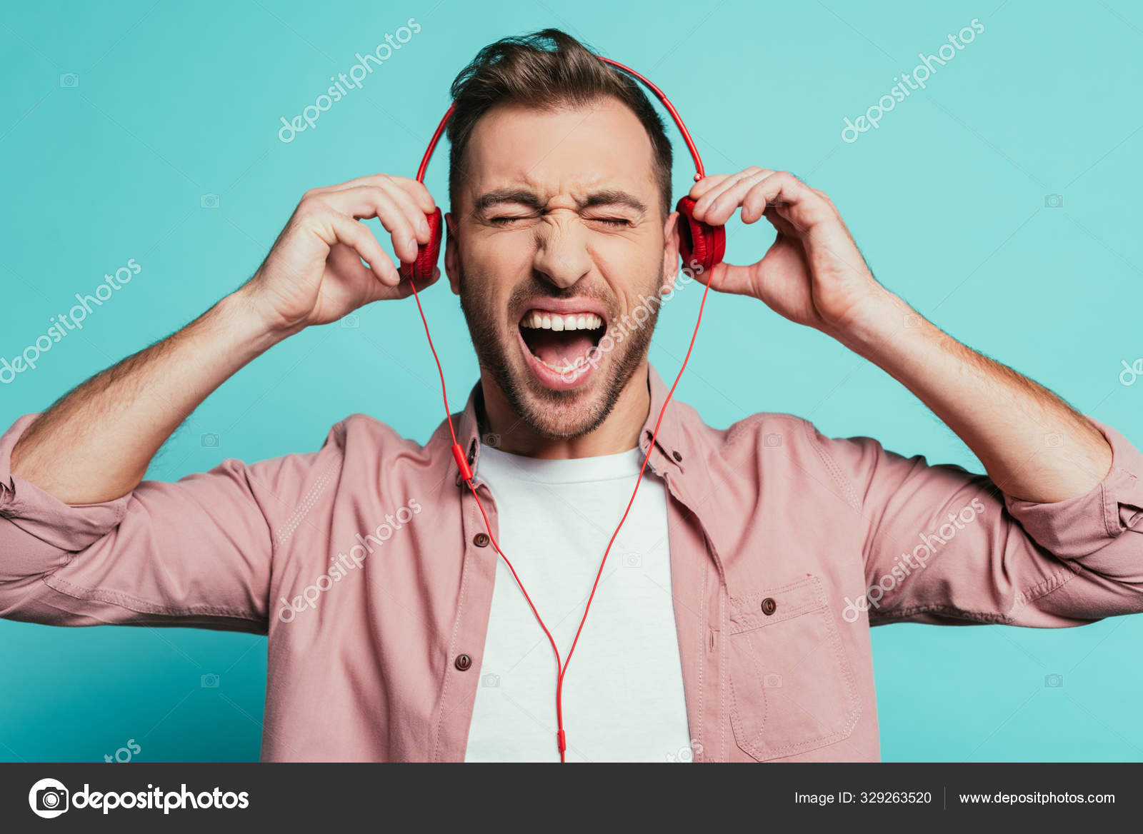 Excited Man Yelling Listening Music Headphones Isolated Blue Stock ... Excited Man Yelling Listening Music Headphones Isolated Blue Stock ...