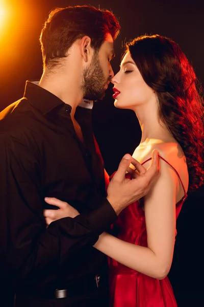 Side View Elegant Man Kissing Beautiful Girlfriend Red Dress Black