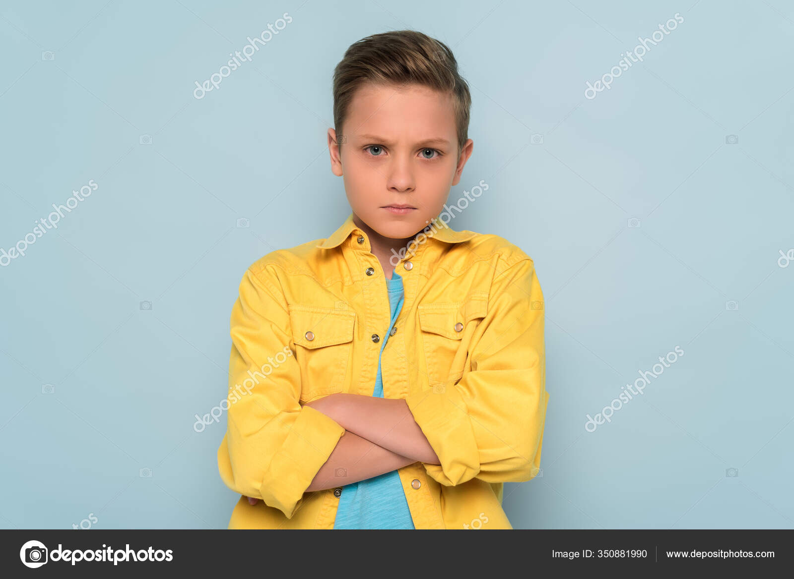 Offended Kid Crossed Arms Looking Camera Blue Background Stock Photo by ...