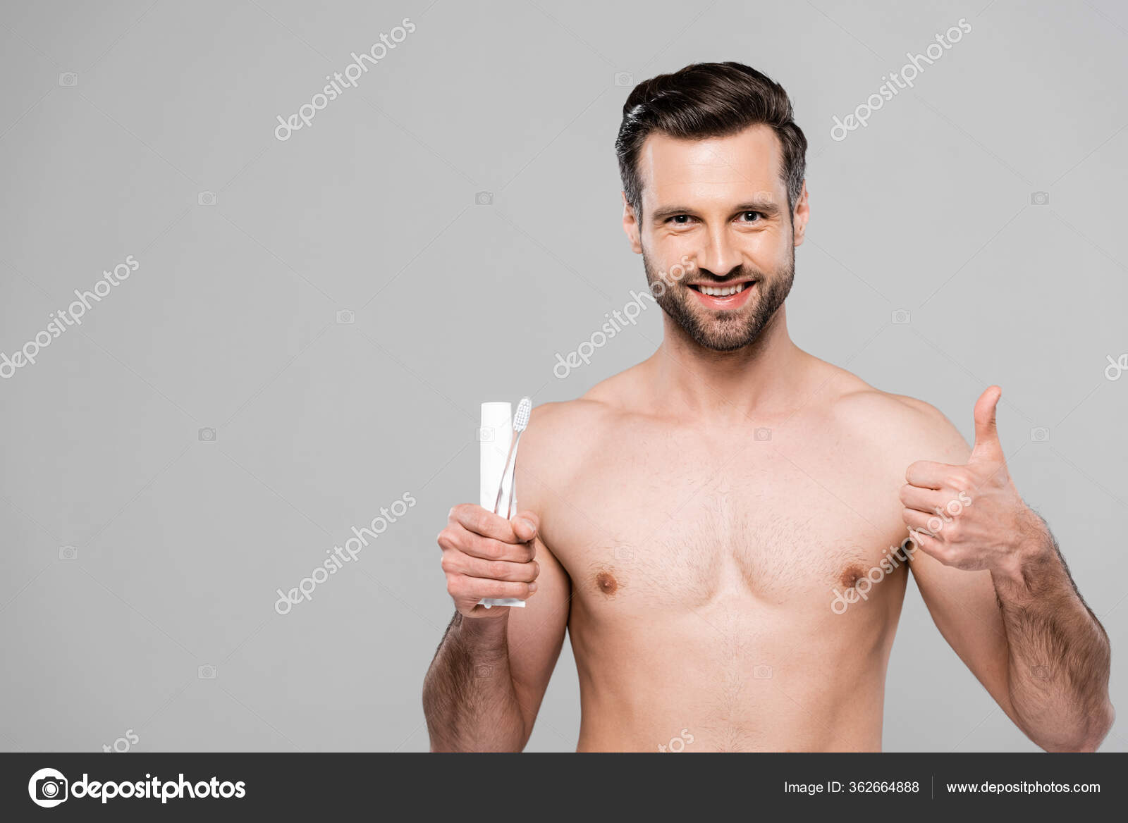 Happy Muscular Man Holding Toothpaste Toothbrush While Showing Thumb ...