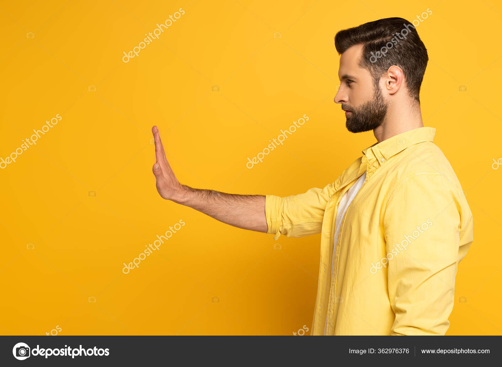 Side View Handsome Man Showing Sign Yellow Background Stock Photo by ...