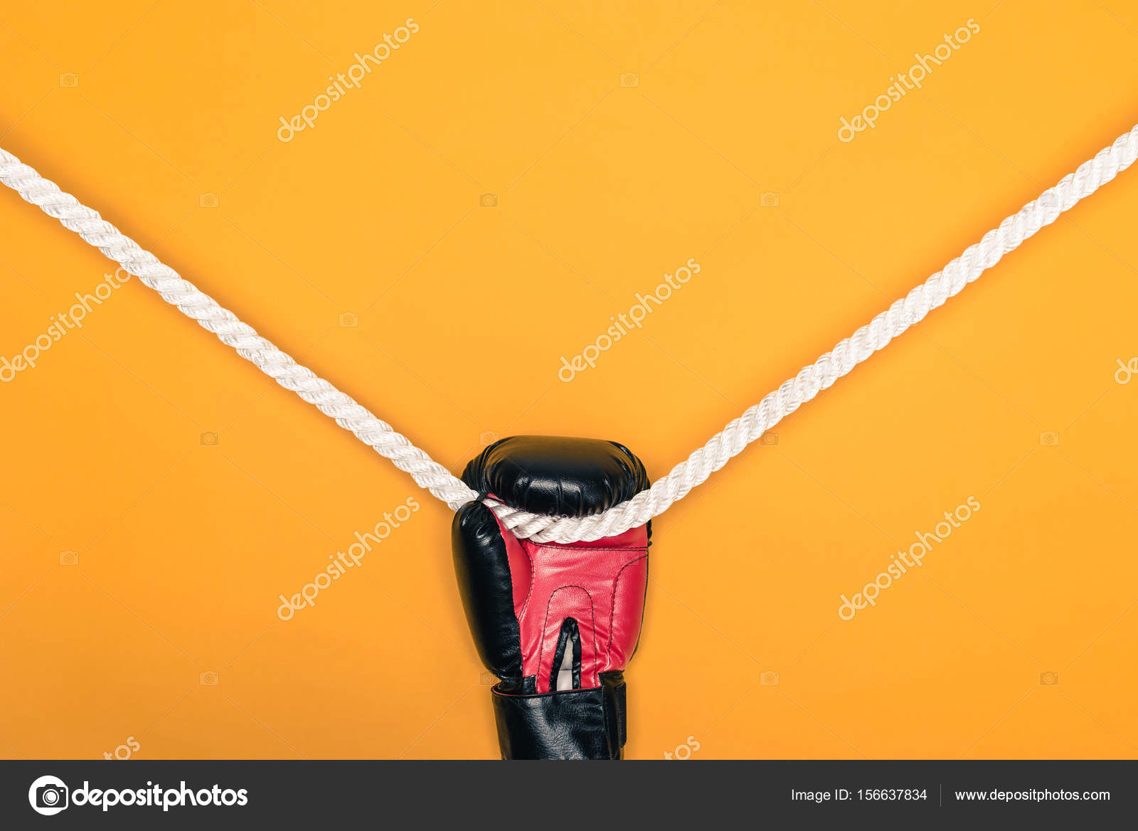 Boxing glove hanging on rope Stock Photo by ©KostyaKlimenko 156637834